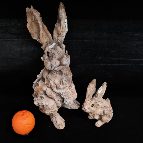 Two unique Irish hare sculptures with glass eyes.