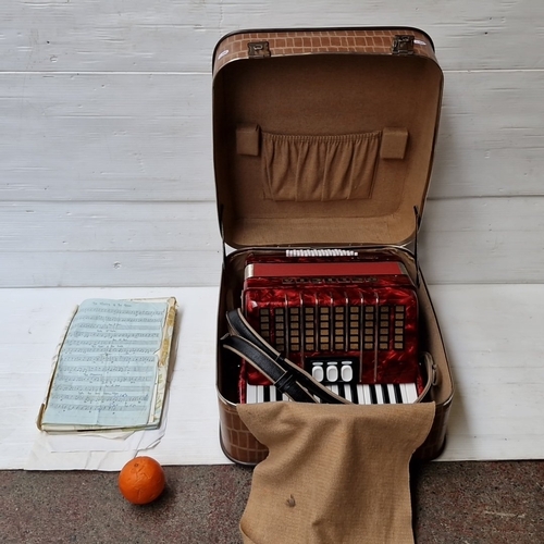 Red pearloid Delicia “Junior” piano accordion, three treble registers ...