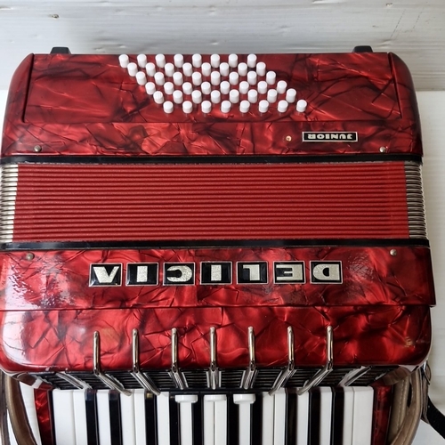 Red pearloid Delicia “Junior” piano accordion, three treble registers ...