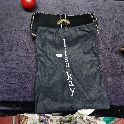 Black leather clutch bag by Lisa Kay, rectangular with white zig-zag ...