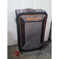 Two Timberland grey and black soft-shell wheeled suitcase with orange ...