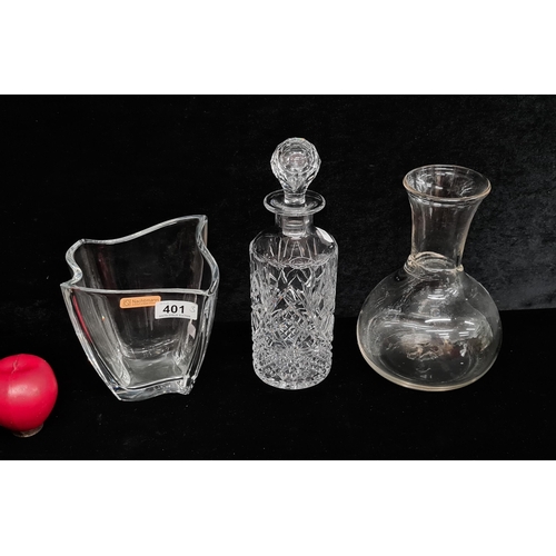 Three pieces of glassware including a German Nachtmann vase, a decanter ...