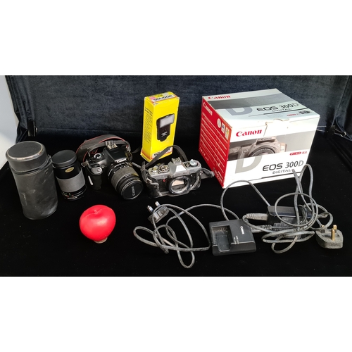 A photography enthusiasts lot comprised of a Canon DS126291, A Minolta ...