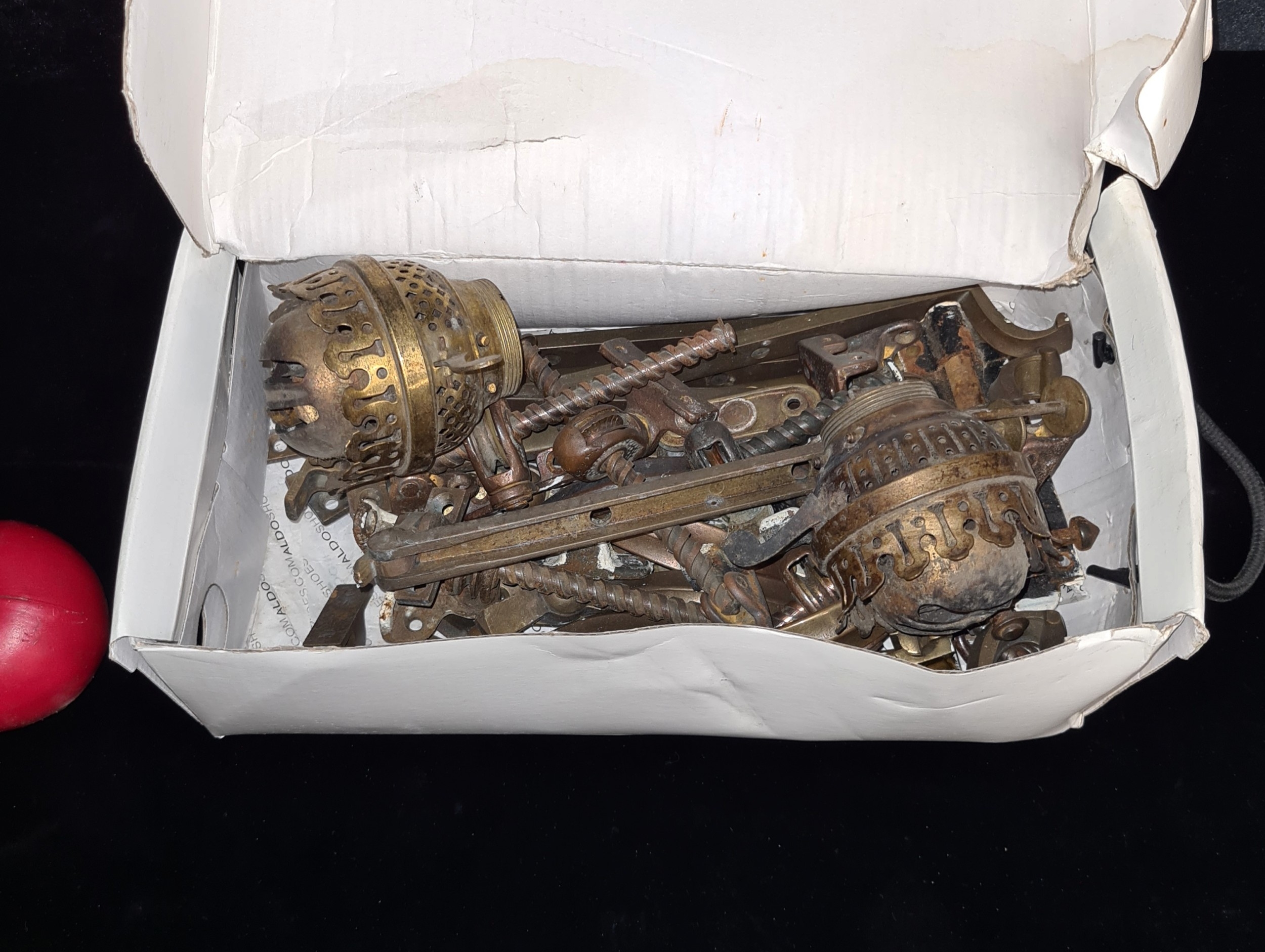 A box full of antique and vintage brass window hardware including ...