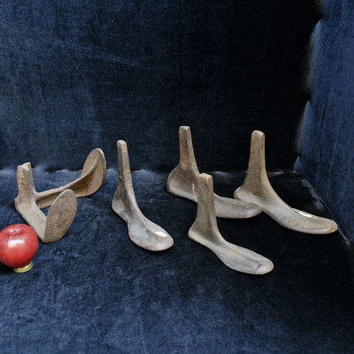 A selection of five antiuqe cast iron cobbler's shoe lasts / anvils.