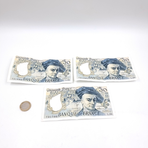 Three vintage 50 French Franc banknotes featuring the portrait of ...