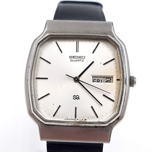 A Seiko Quartz wristwatch with baton dial, sweep second hand and black ...