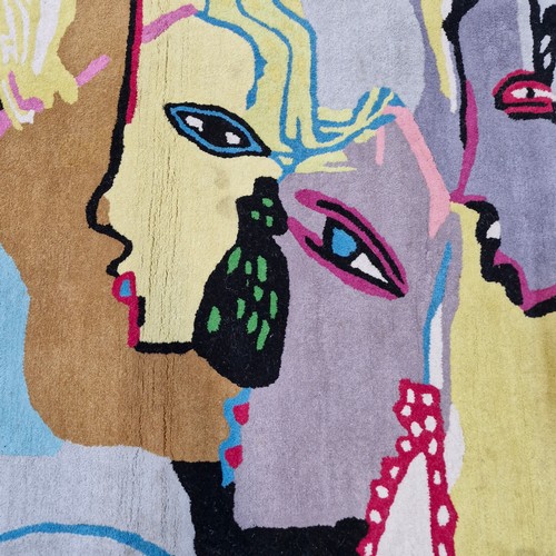 A vibrant modern rug featuring a bold abstract painterly composition ...
