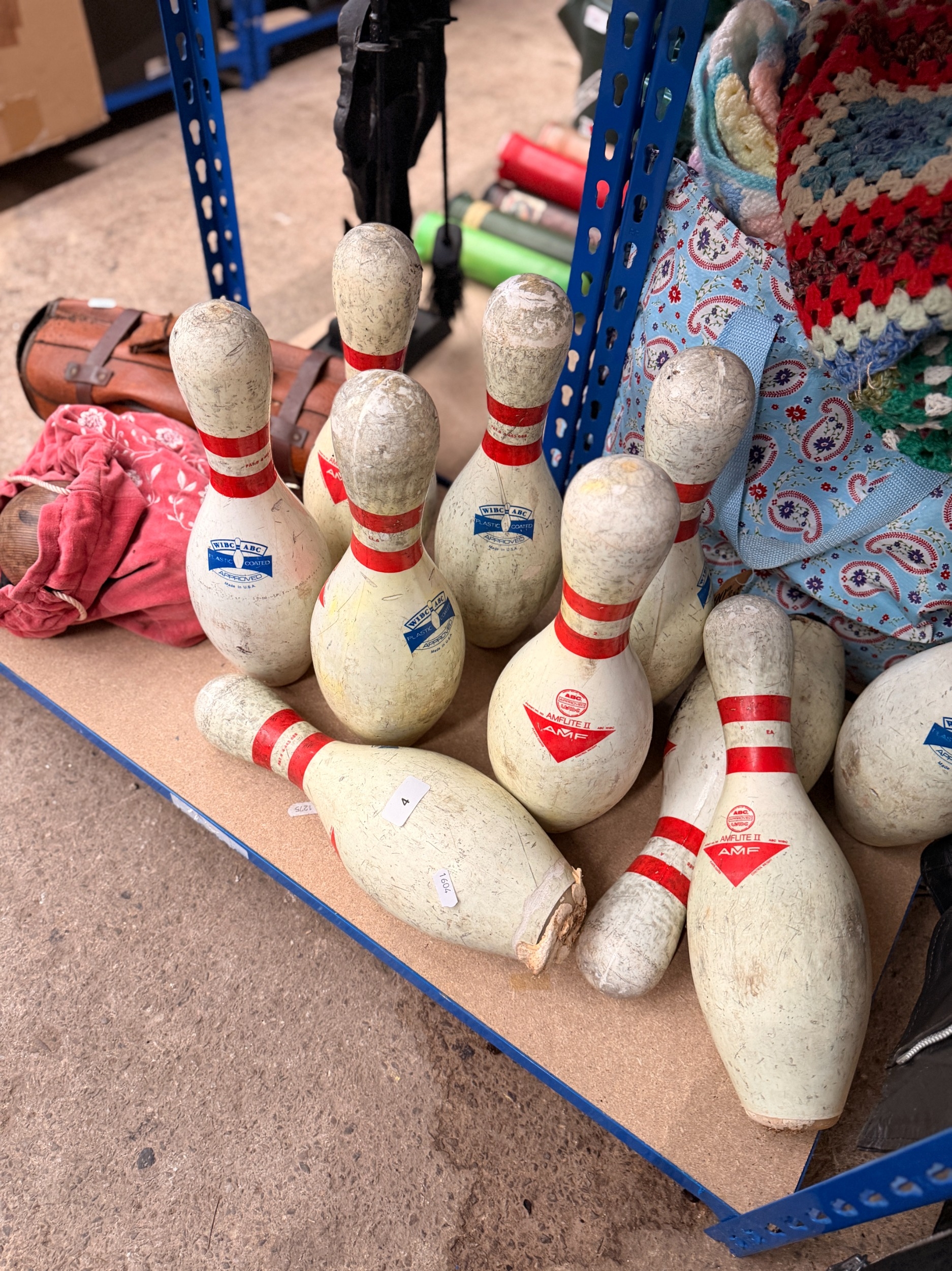 10 vintage bowling pins and 6 bowling balls