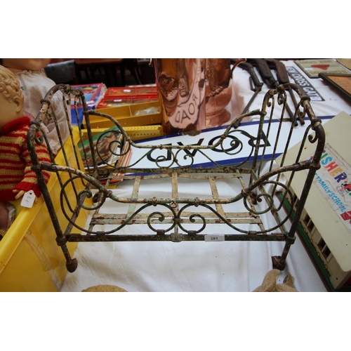 Vintage French toy doll's cot, ornate metal with original castors