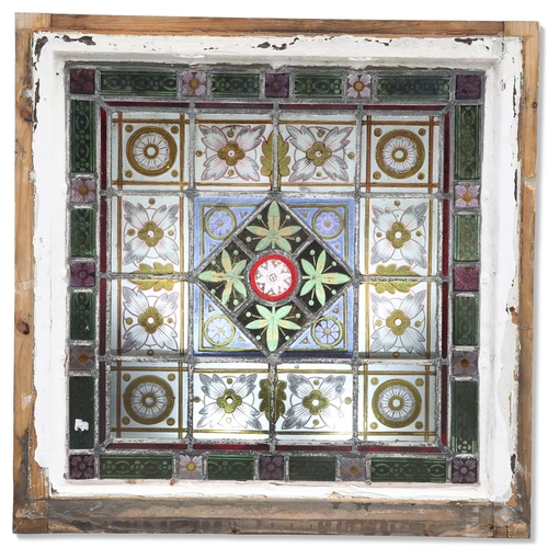 AN ARTS AND CRAFTS LEADED AND STAINED GLASS WINDOW, square, in a wooden ...