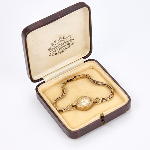 A LADY'S 9CT GOLD LEDA BRACELET WATCH the circular ivory dial signed ...