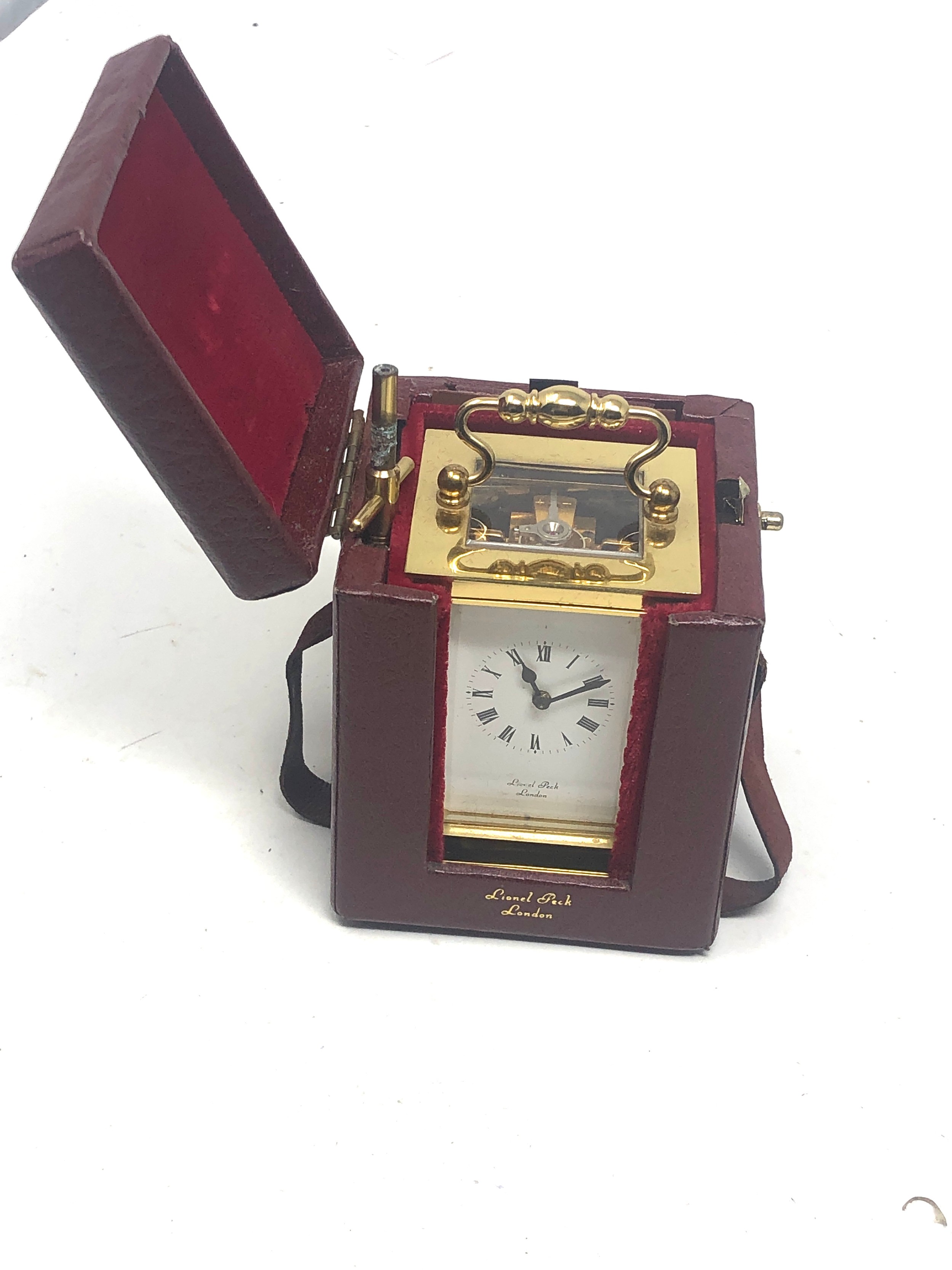 small cased Brass carriage clock by lionel peck london the clock ticks
