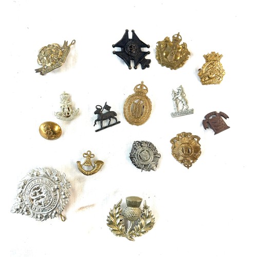 Selection of vintage cap badges