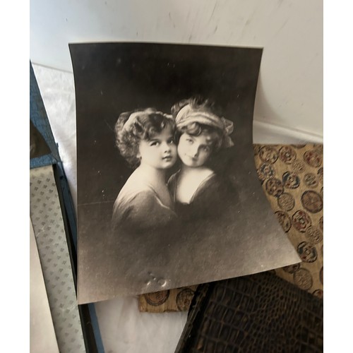 Selection of vintage photograph albums some with old portrait photos