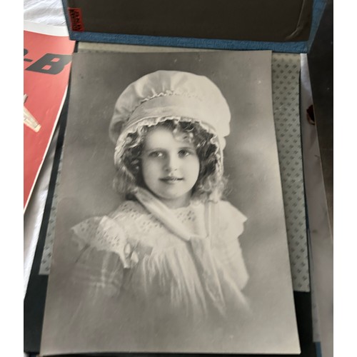 Selection of vintage photograph albums some with old portrait photos