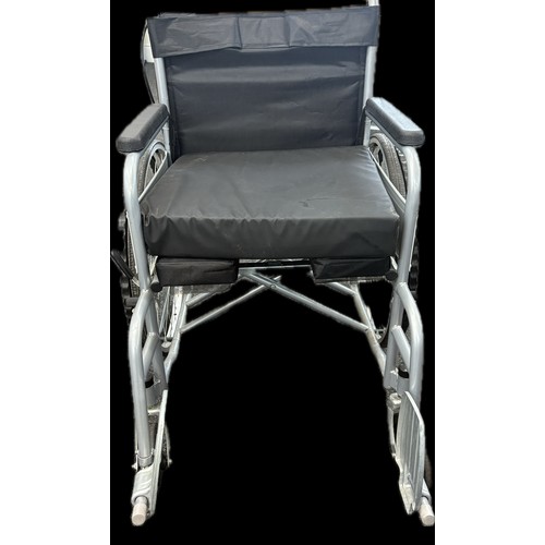 Folding wheelchair with cushion, moulded leg rests, approximate ...
