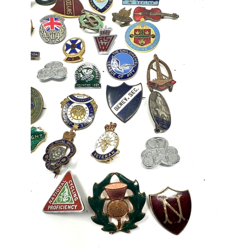 selection of vintage enamel badges