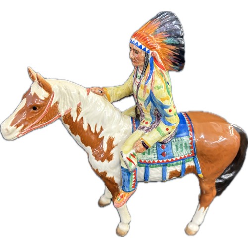 Three vintage Beswick mounted figures to include an Indian, Cowboy and ...