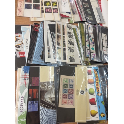 Large selection of sealed stamp presentation packs