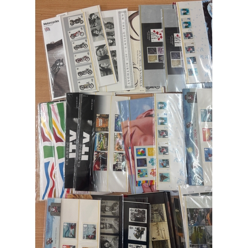 Large selection of sealed stamp presentation packs
