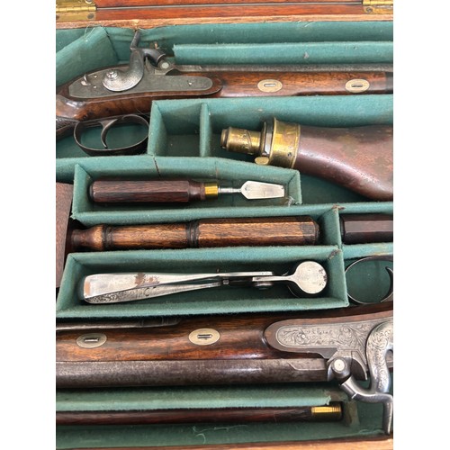 A fine cased antique pair of Joseph Lang Percussion Dueling pistols ...