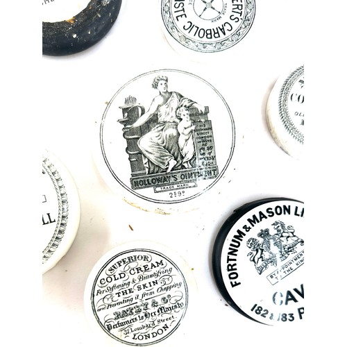 Selection antique advertising pot lids to include Boots, W Woods ...