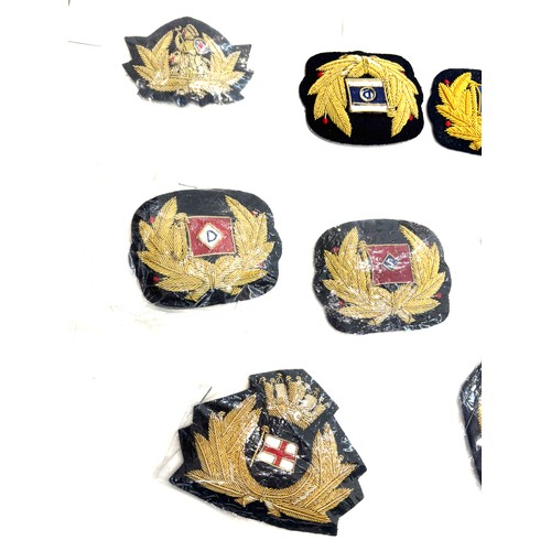 10 Different hand embroidered gold wire merchant navy officers cap badges