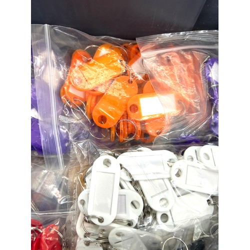 Large quantity of brand new plastic key tabs, various colours