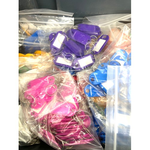 Large quantity of brand new plastic key tabs, various colours