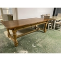 A heavy pine dining table with stretcher to base 218 cm long 107 cm wide