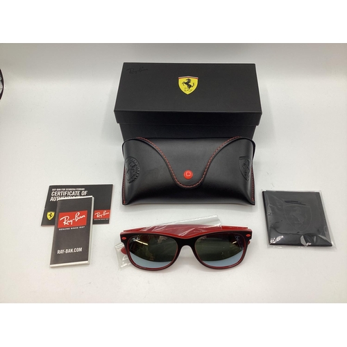 A pair of Ray-Ban Ferrari sunglasses in black and red stitched case ...