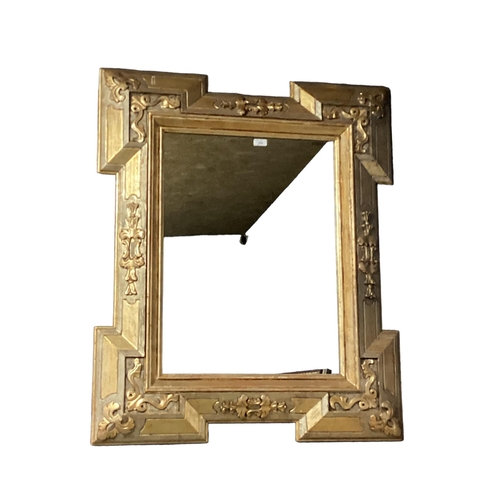 A contemporary rectangular gilt framed wall mirror, with floral pattern to mount, 100cmH x 83cm W, m
