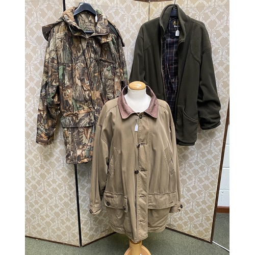Three sporting country coats: A Deerhunter camouflage jacket, A Barbour ...