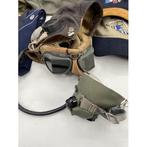A leather flying hat complete with goggles, and a quantity of FLYING ...