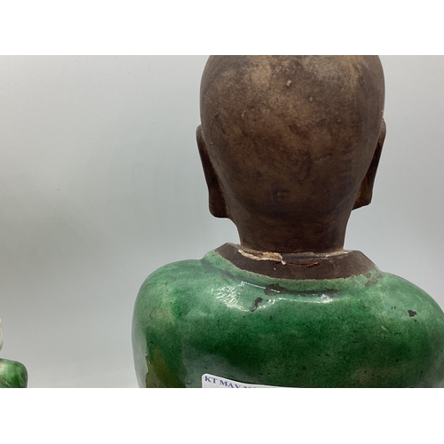 Two Tang dynasty style polychrome glazed figures of Guanyin and ...