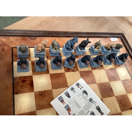 A modern Chess board with novel cat and dog chess pieces