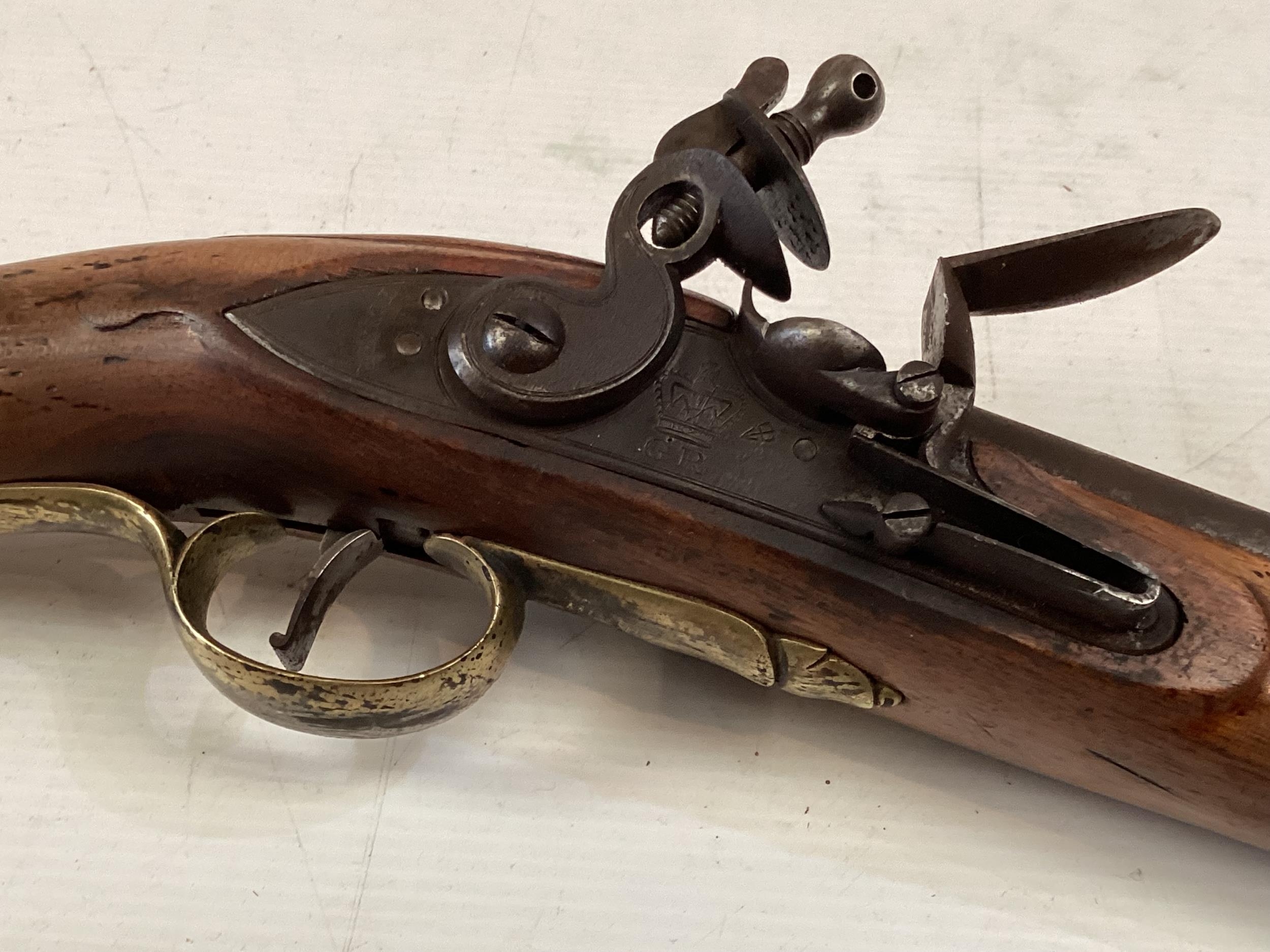 A flintlock pistol Stamped 'Tower' GR Cypher with Crown and broad arrow ...