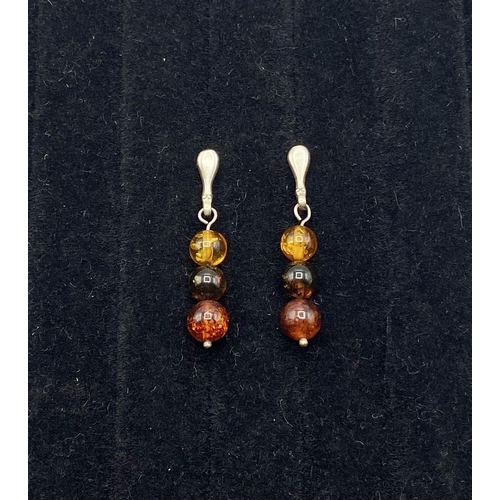 A pair of amber drop ear rings.