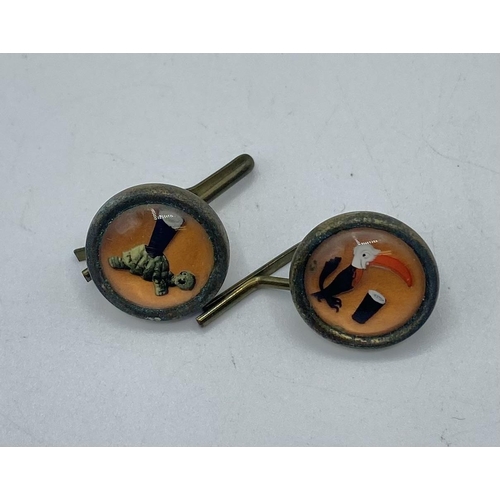 A set of five collectable Guinness reverse glass painted buttons.
