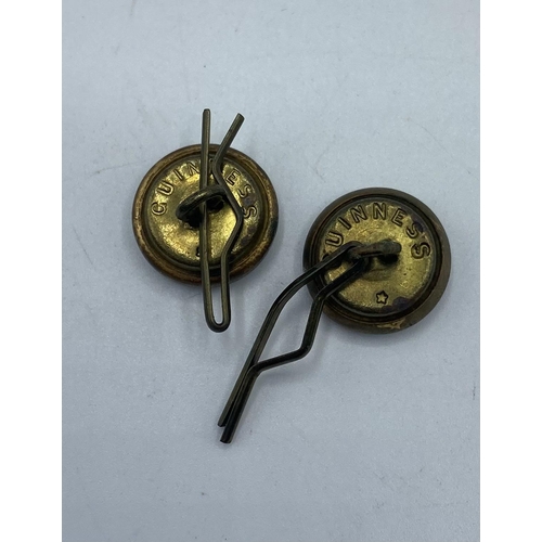 A set of five collectable Guinness reverse glass painted buttons.