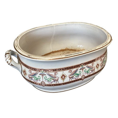 A large two handled ceramic foot bath
