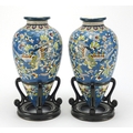 Pair of Longwy style pottery vases, with simulated stands, each ...
