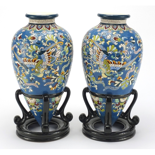 Pair of Longwy style pottery vases, with simulated stands, each ...