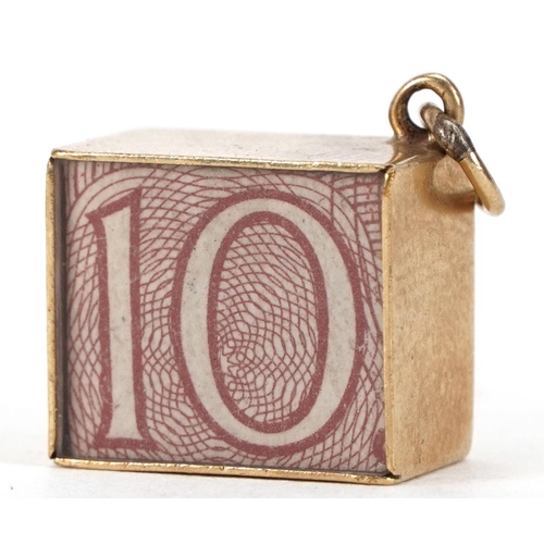 9ct gold emergency ten shilling note charm, 1.4cm wide, 2.7g