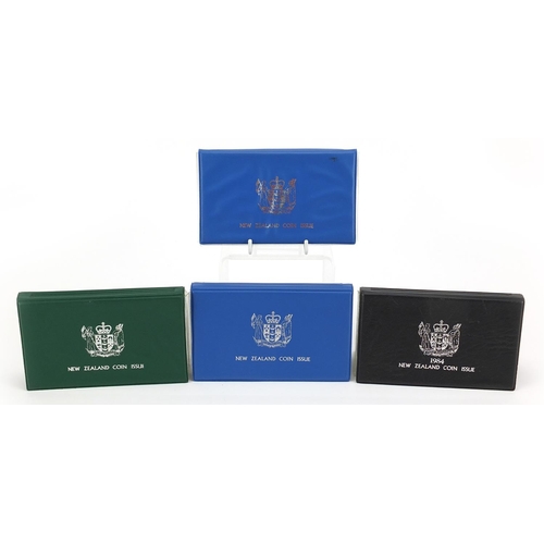 Four New Zealand proof coin sets each with silver dollars, comprising ...