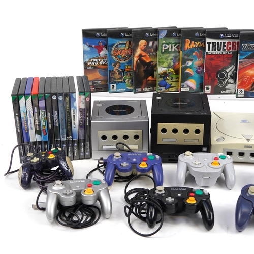 Two Nintendo Game Cube games consoles with controllers, games and a ...