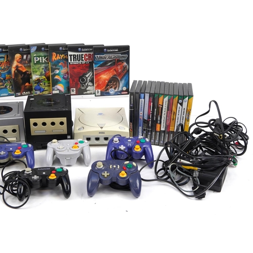 Two Nintendo Game Cube games consoles with controllers, games and a ...