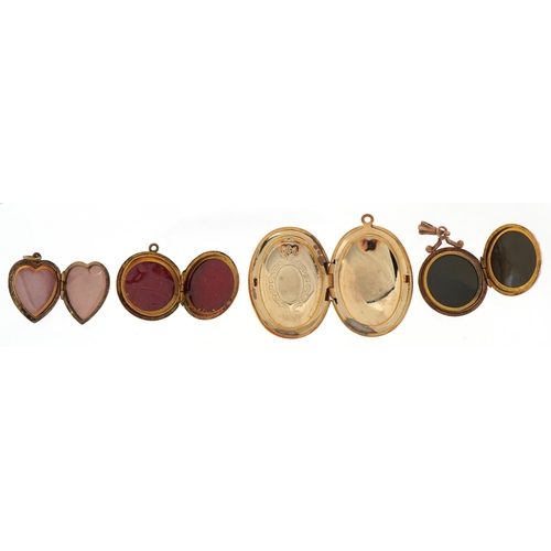 Four yellow metal lockets including a 9ct gold back and front example ...