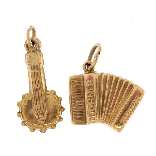 Two 9ct gold musical instrument charms comprising guitar and accordion ...